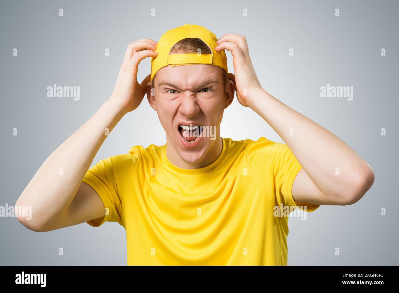 Stressful teenager screaming with panic Stock Photo - Alamy