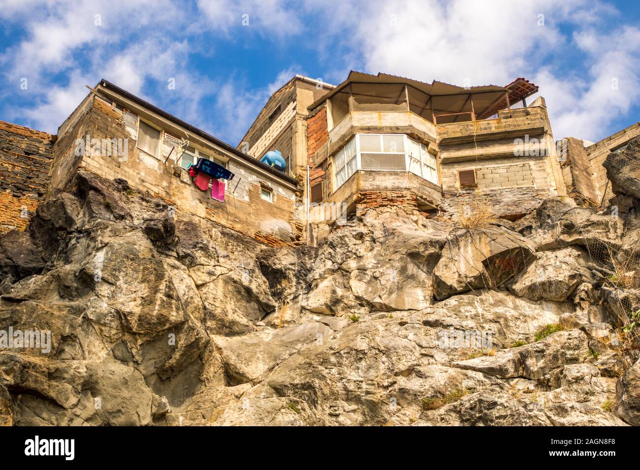 Precariously hi-res stock photography and images - Alamy