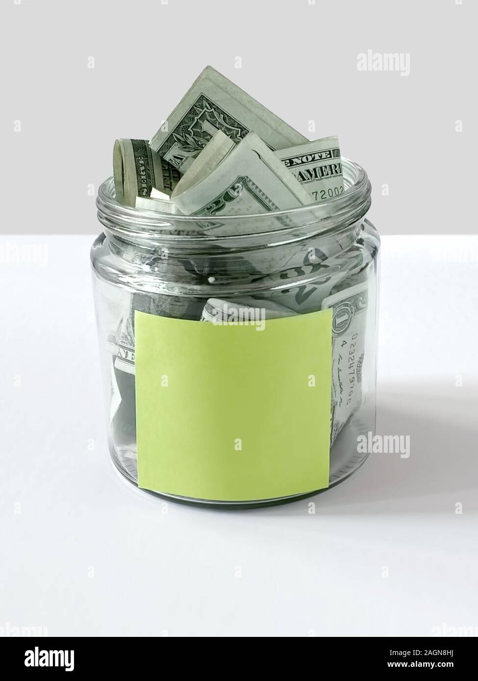 Dollar savings money jar banknote hi-res stock photography and images ...