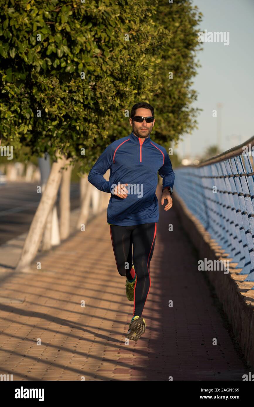 Young man running in the city , Alicante, Spain, Europe Stock Photo - Alamy