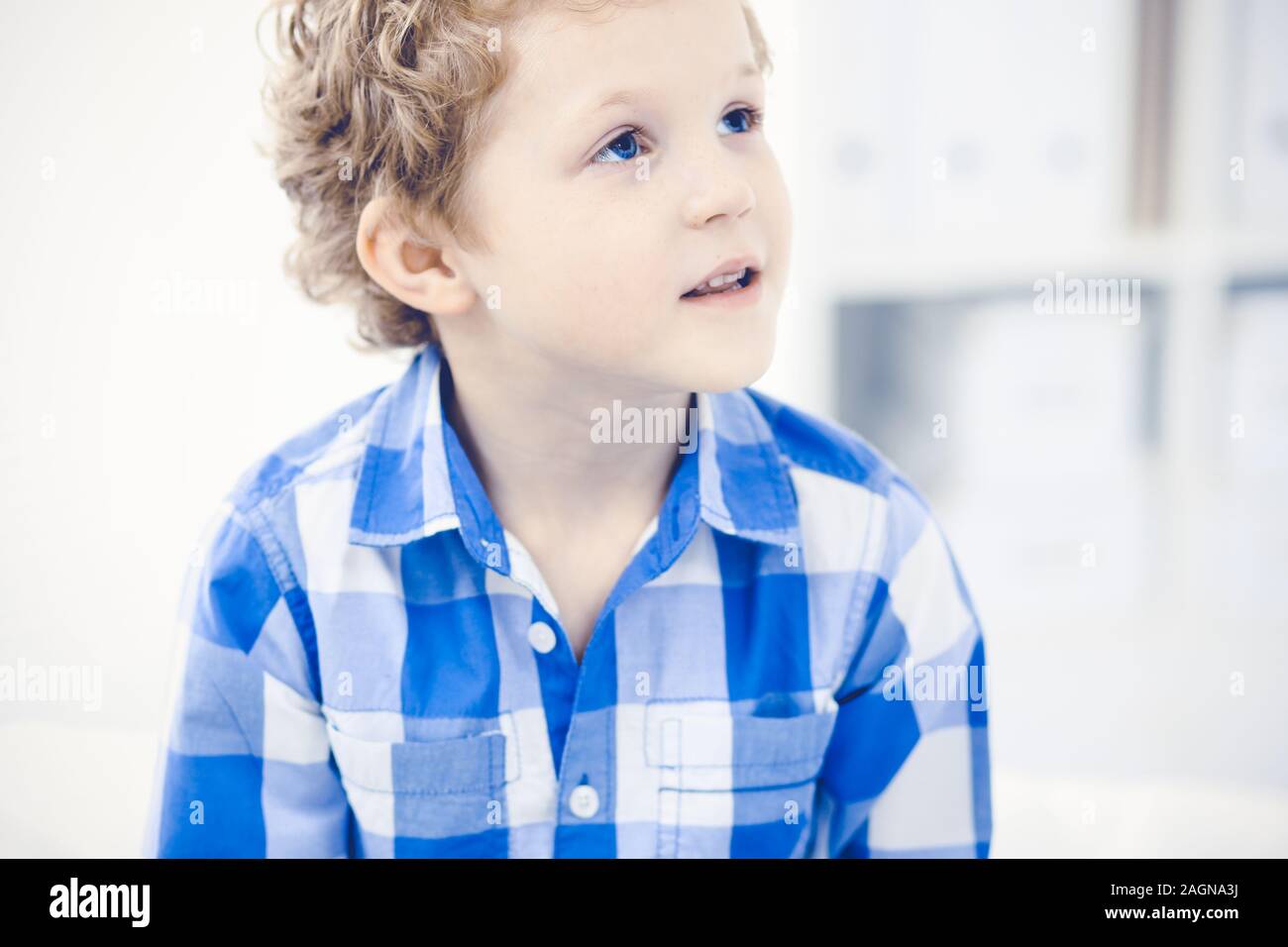 Doctor and patient child. Physician examining little boy. Regular ...