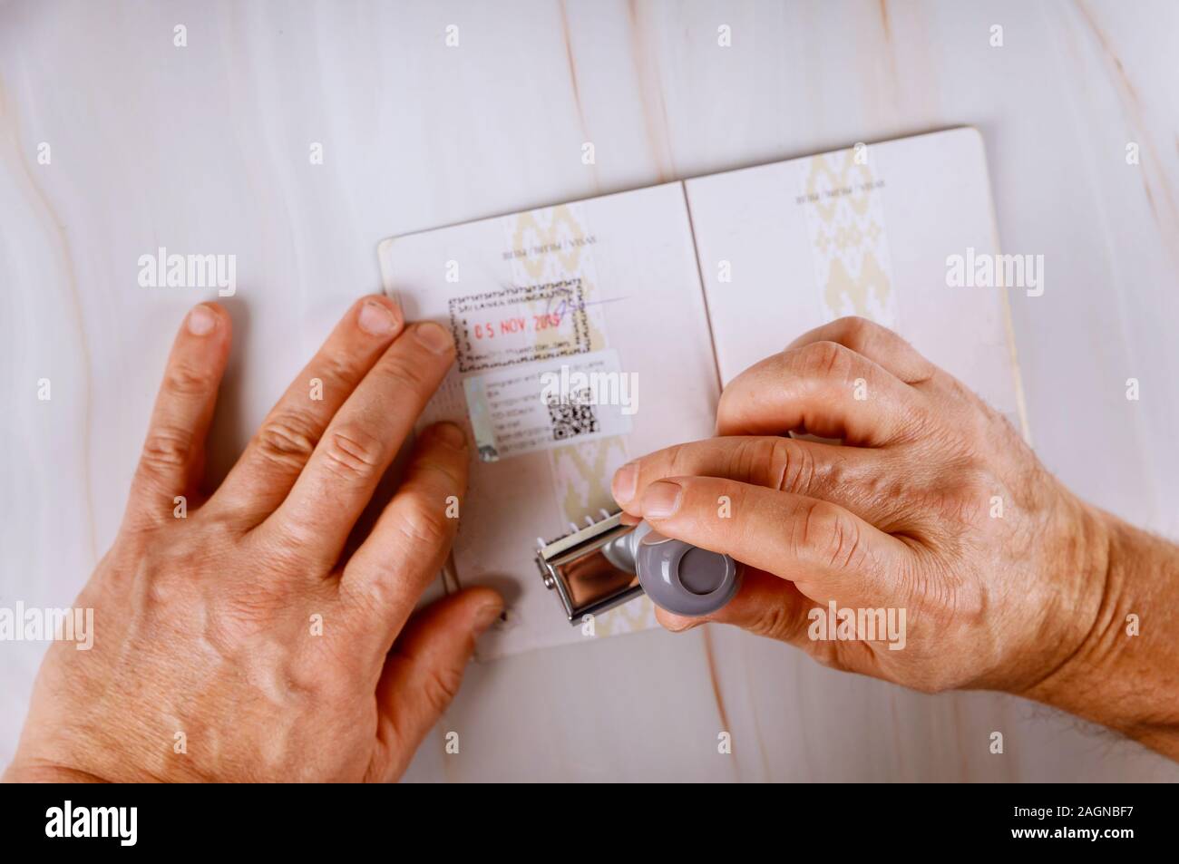Immigration Service control border control officer puts a stamp in the ...