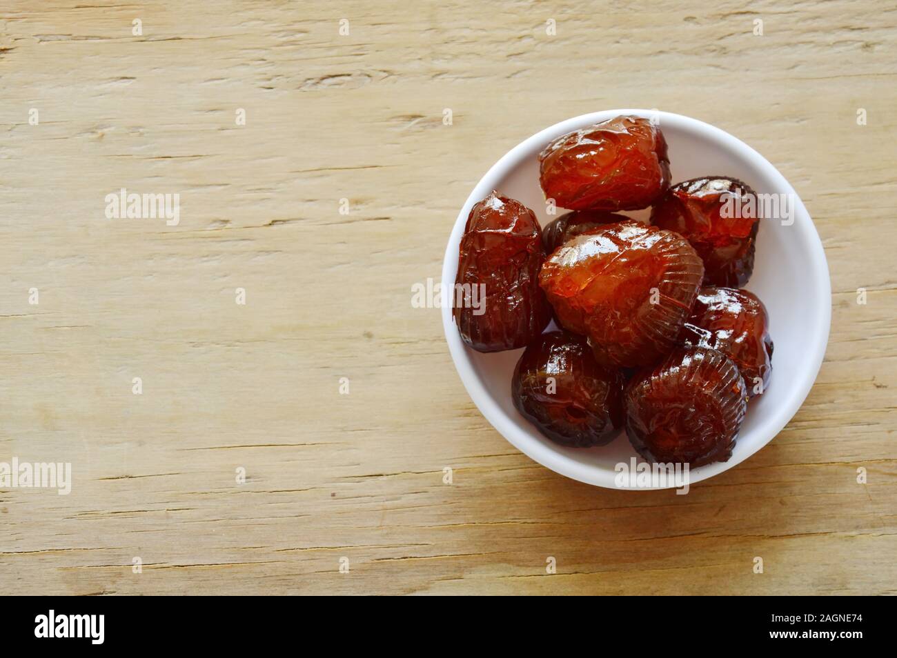 Chinese jujube candy coating syrup on little cup Stock Photo - Alamy