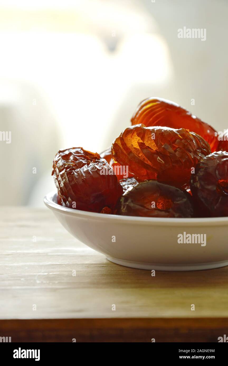 Chinese jujube candy coating syrup on little cup Stock Photo - Alamy