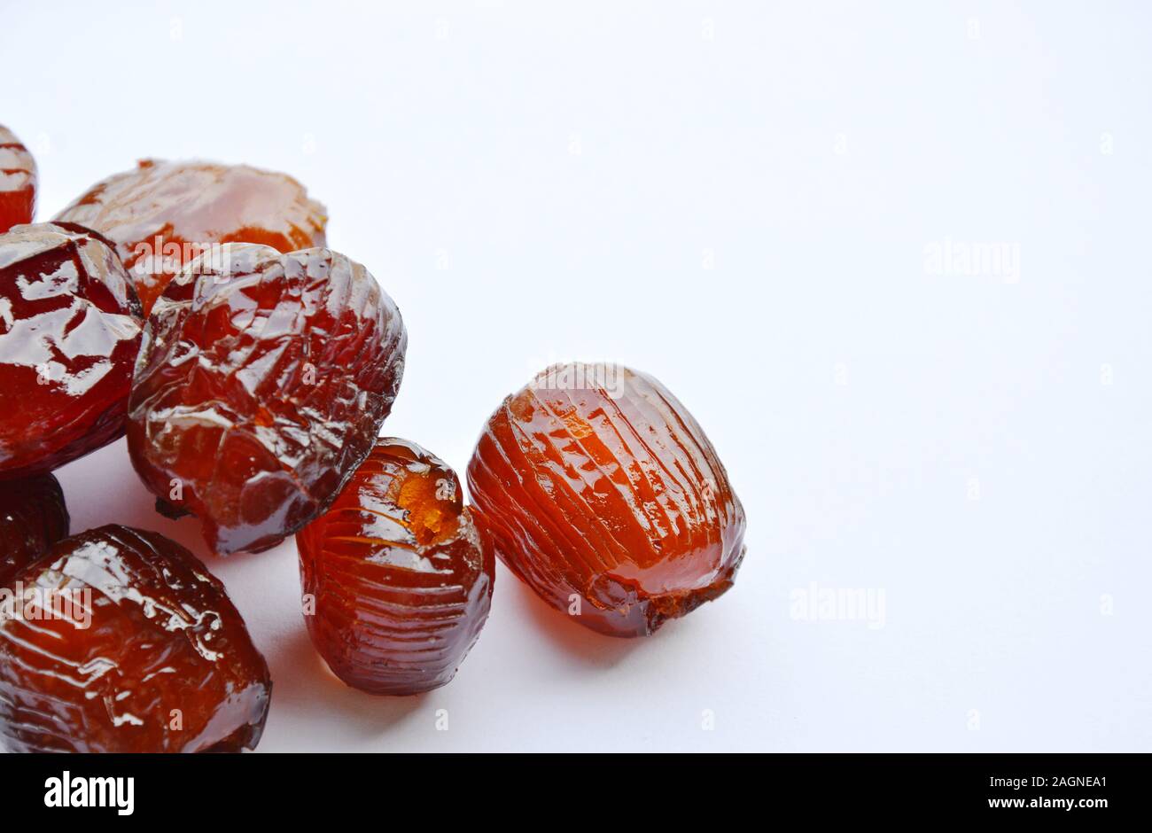 Chinese jujube candy coating syrup on white background Stock Photo - Alamy