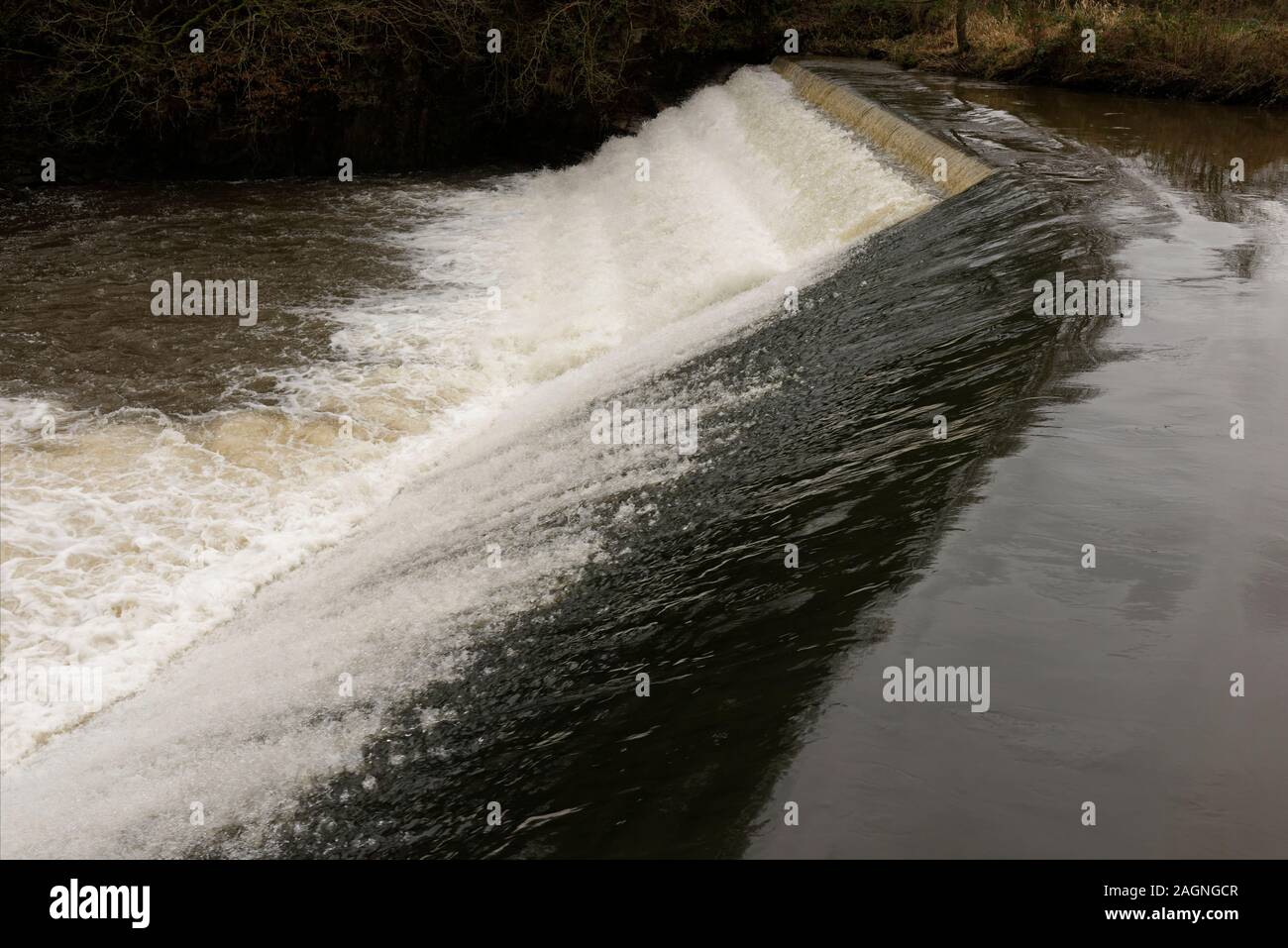 Fast flowing river irwell plunging over weir in burrs country park bury ...