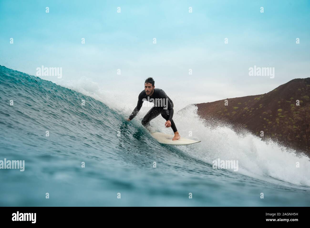 surfer riding waves on the island of fuerteventura Stock Photo - Alamy