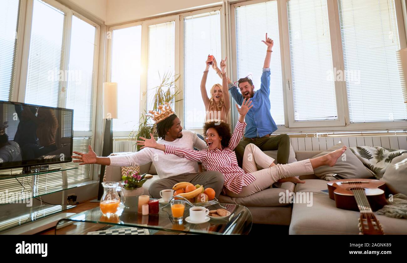 Cheerful people having fun at home Stock Photo - Alamy