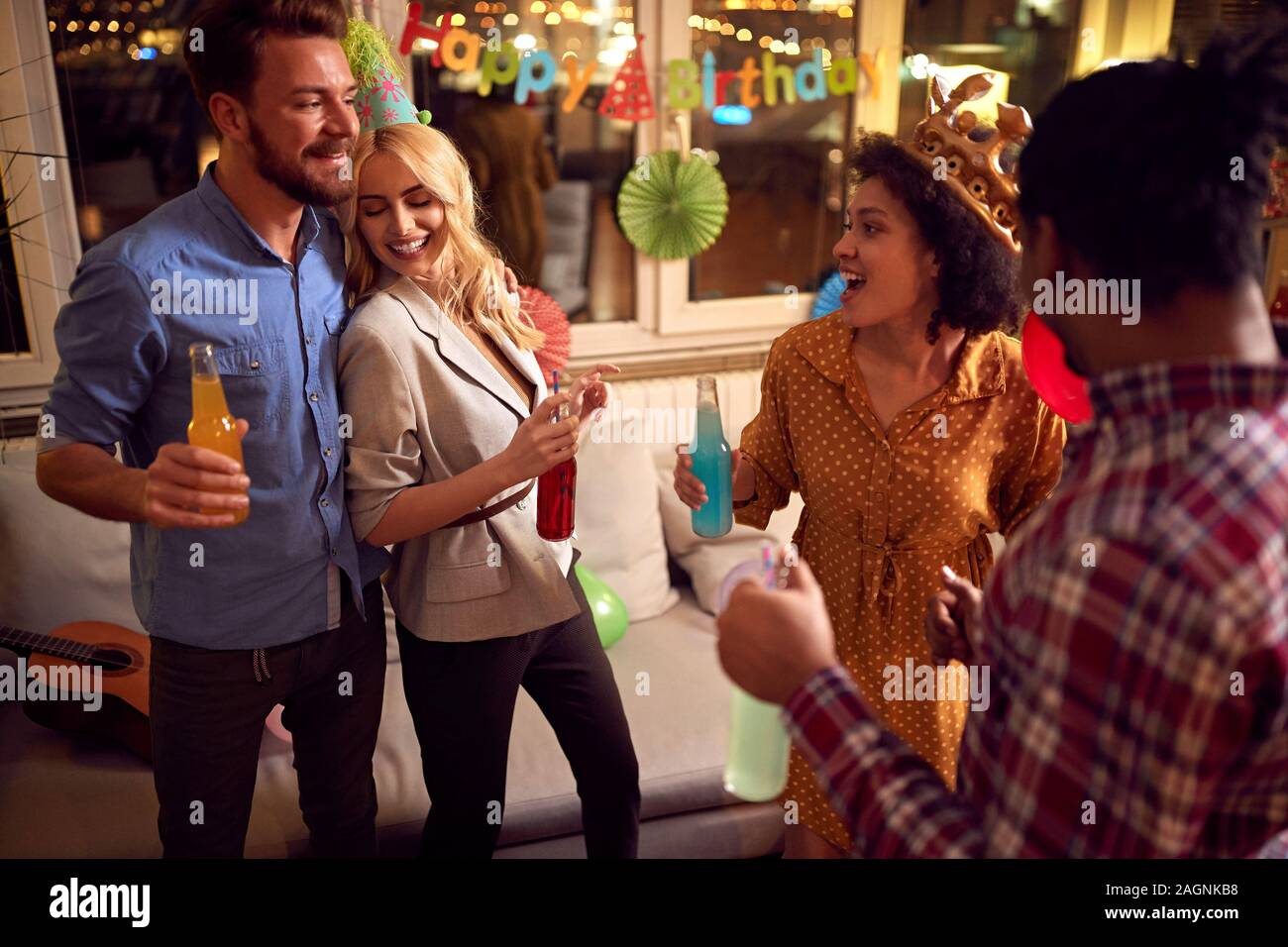 Two couples celebrating birthday indoor Stock Photo - Alamy