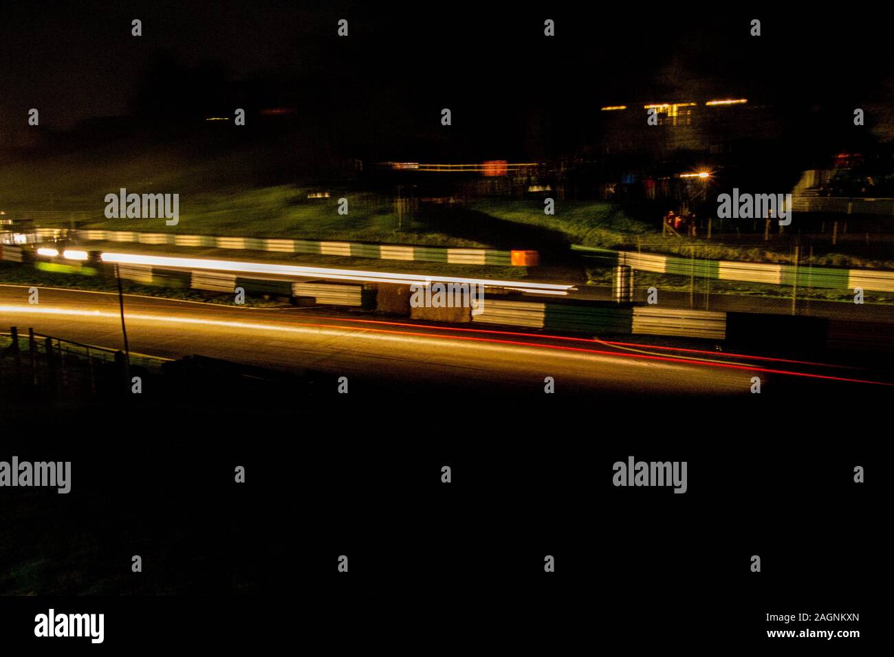 A rally undertaken on a racetrack, carried out at night / dusk Stock ...