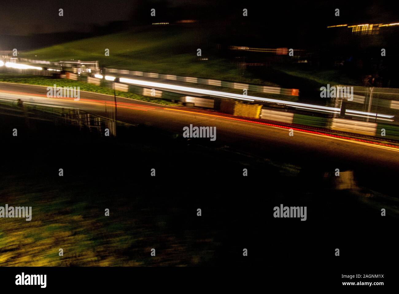 A rally undertaken on a racetrack, carried out at night / dusk Stock ...