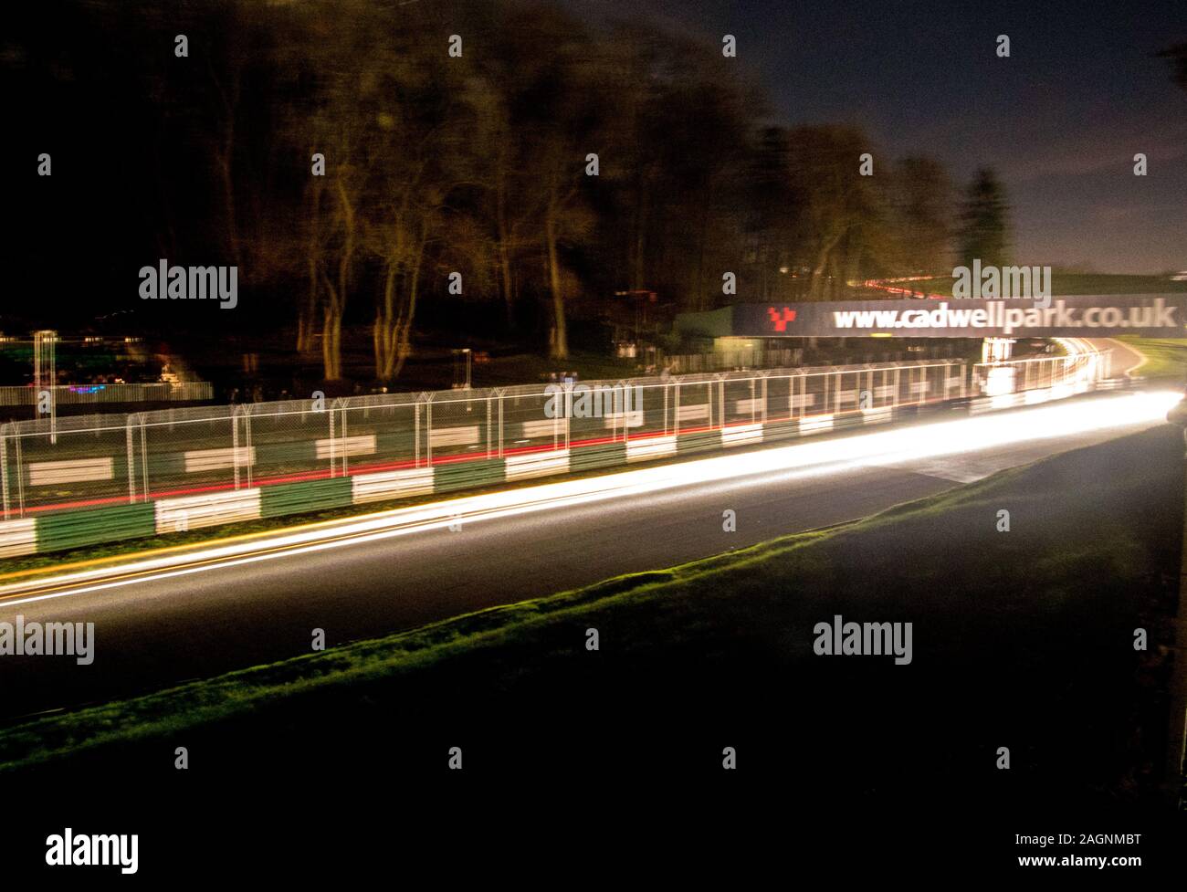 A rally undertaken on a racetrack, carried out at night / dusk Stock ...
