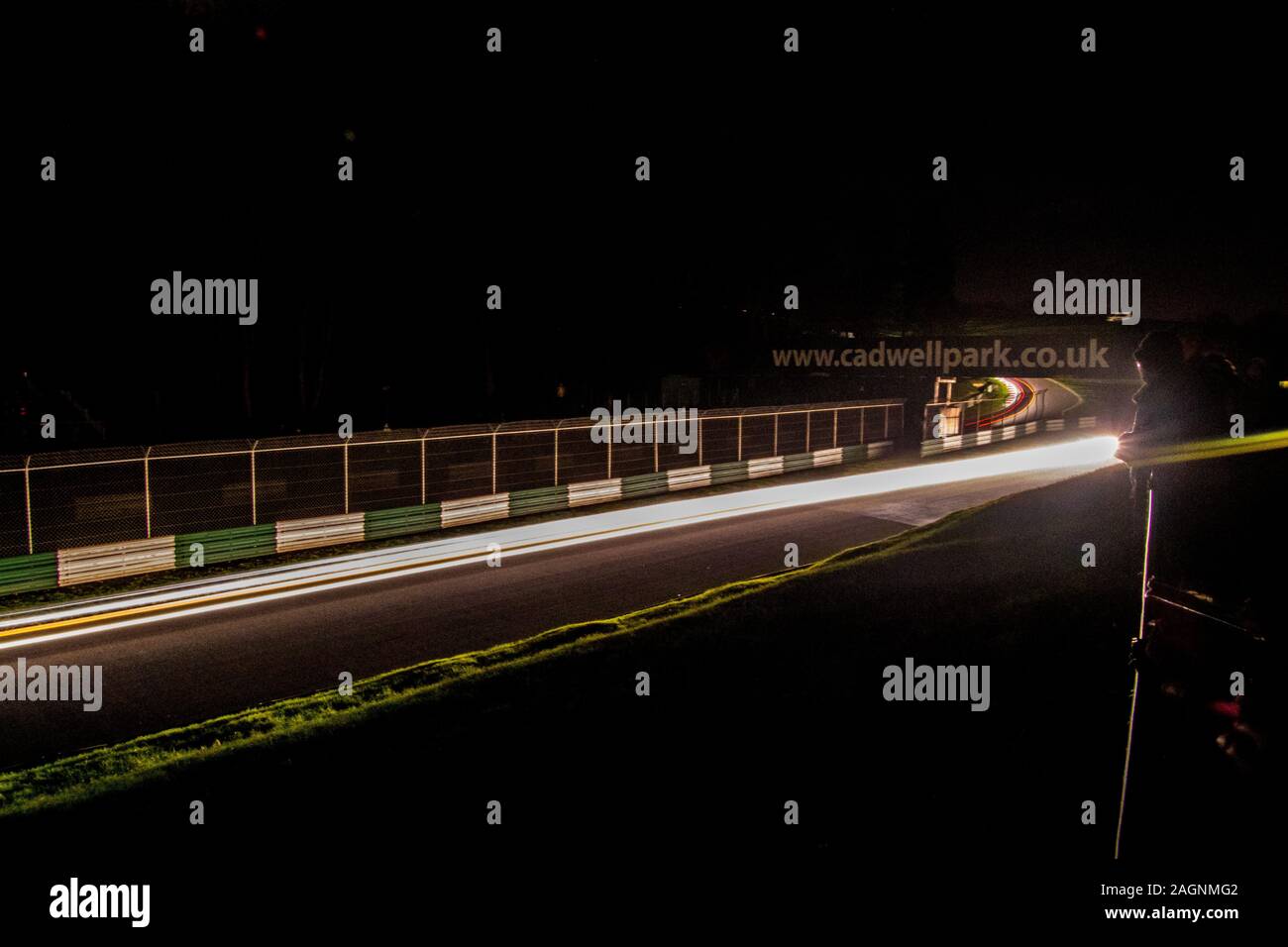 A rally undertaken on a racetrack, carried out at night / dusk Stock ...