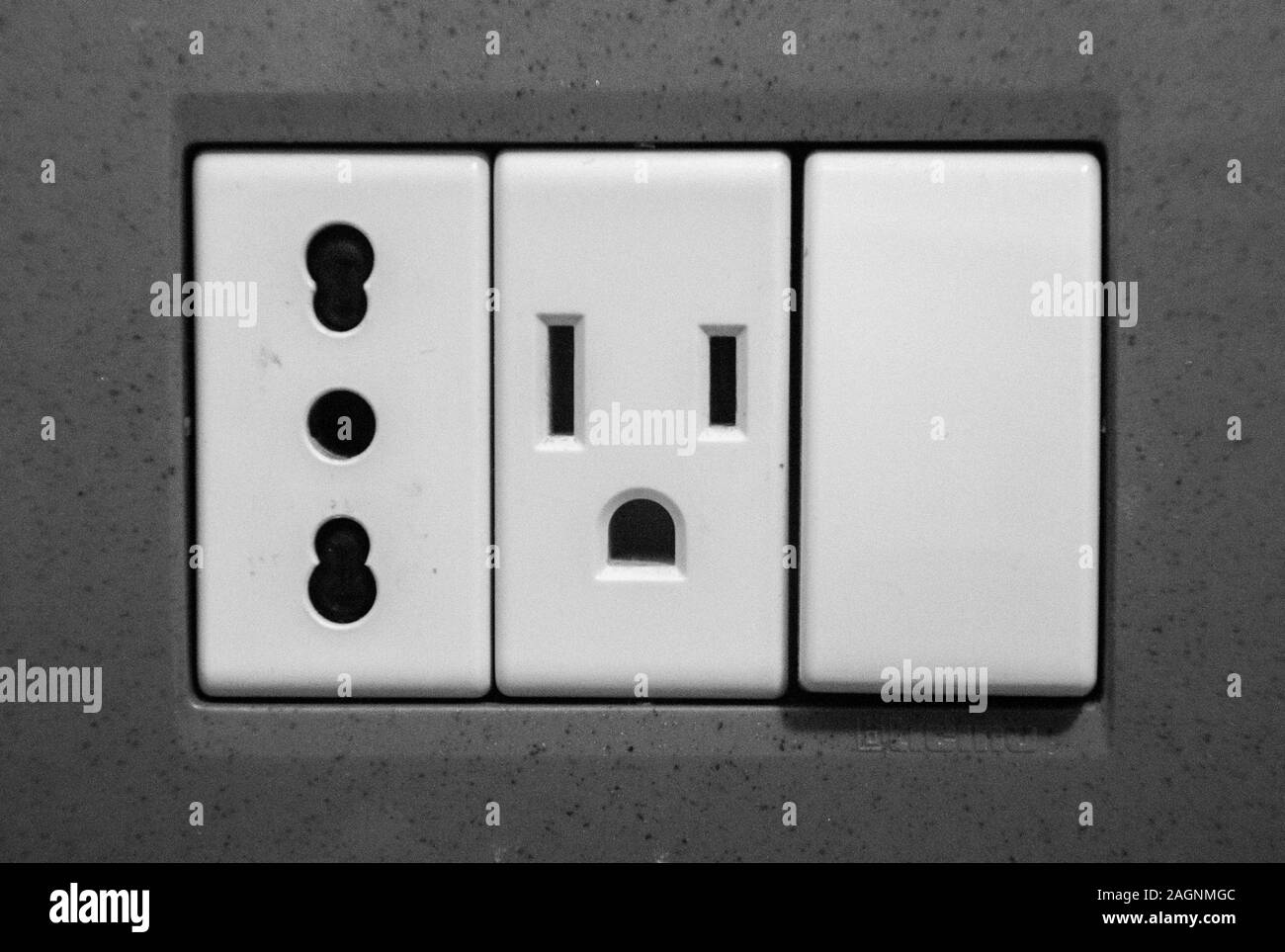 A typical American plug socket which looks like a frightened face Stock ...
