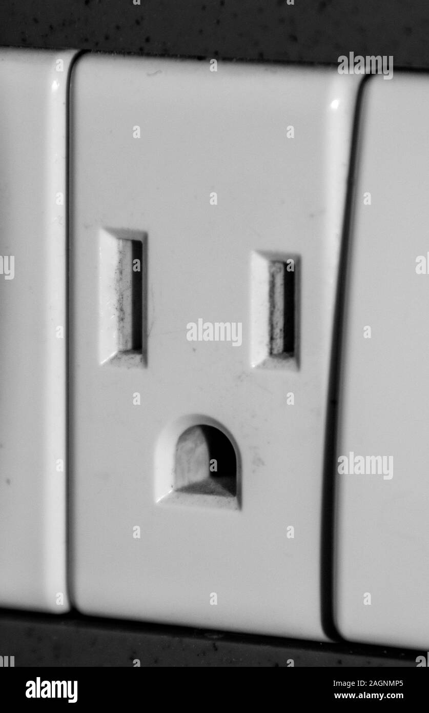 A typical American plug socket which looks like a frightened face Stock ...