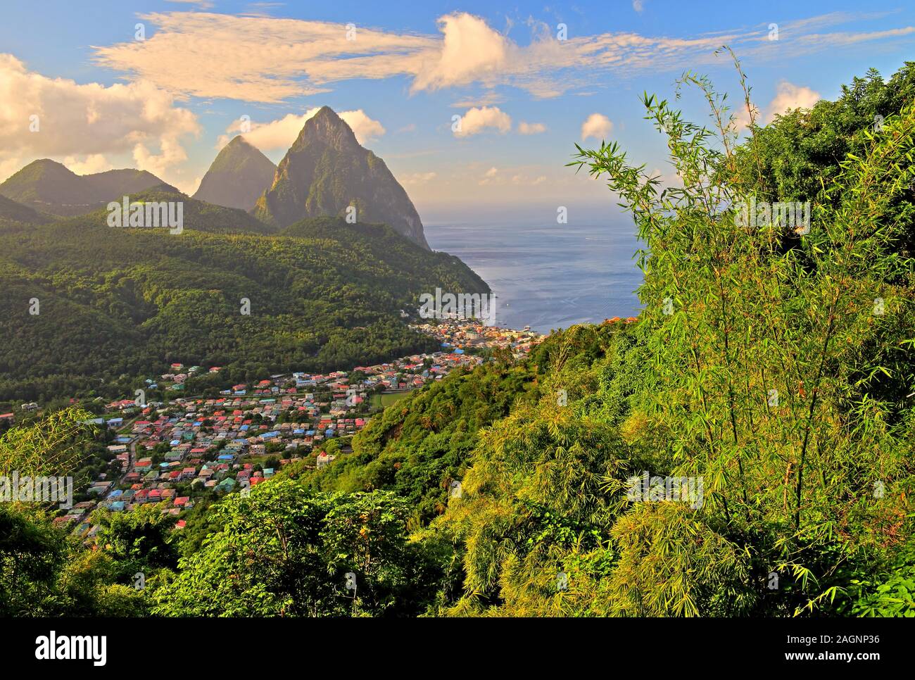 Tropical landscape with view of the village and the two Pitons, Gros ...