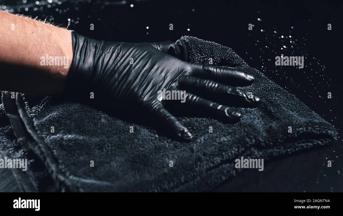 Using rag in palm of your hand, drops are removed from the car. Drop ...