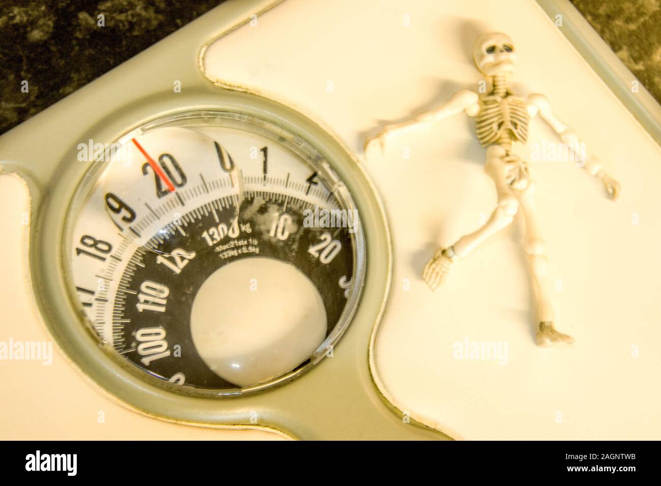 A tiny skeleton on a set of weighing scales Stock Photo - Alamy