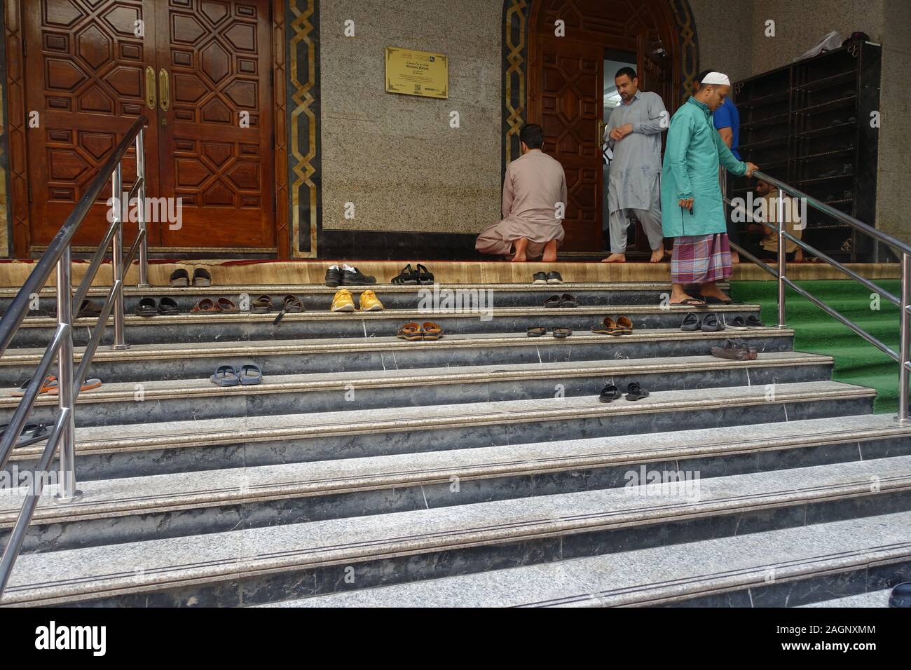 Shoes in front f a mosque in Dubai Stock Photo - Alamy