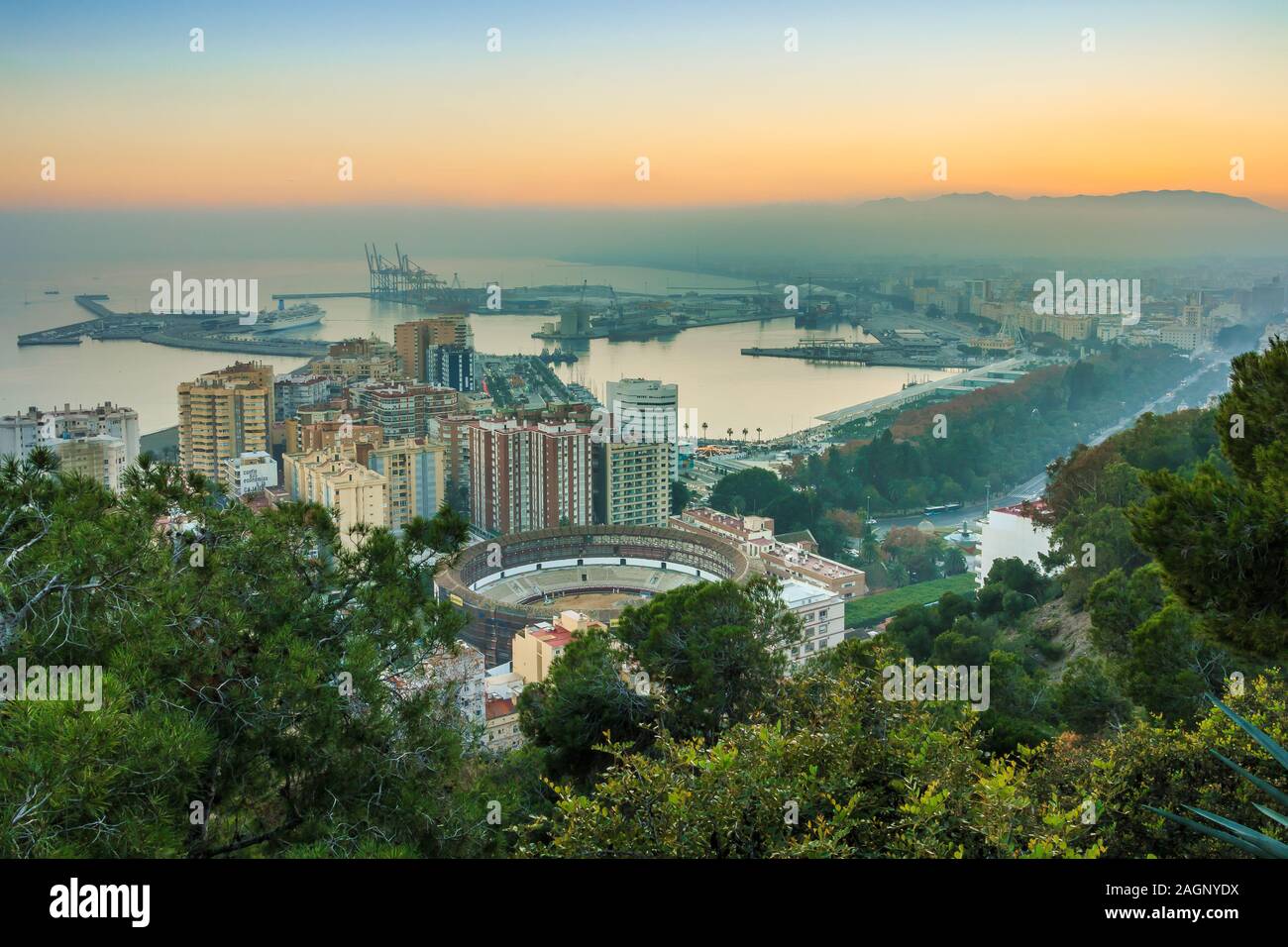 Evening sun over the Spanish city of Malaga on the Mediterranean coast ...