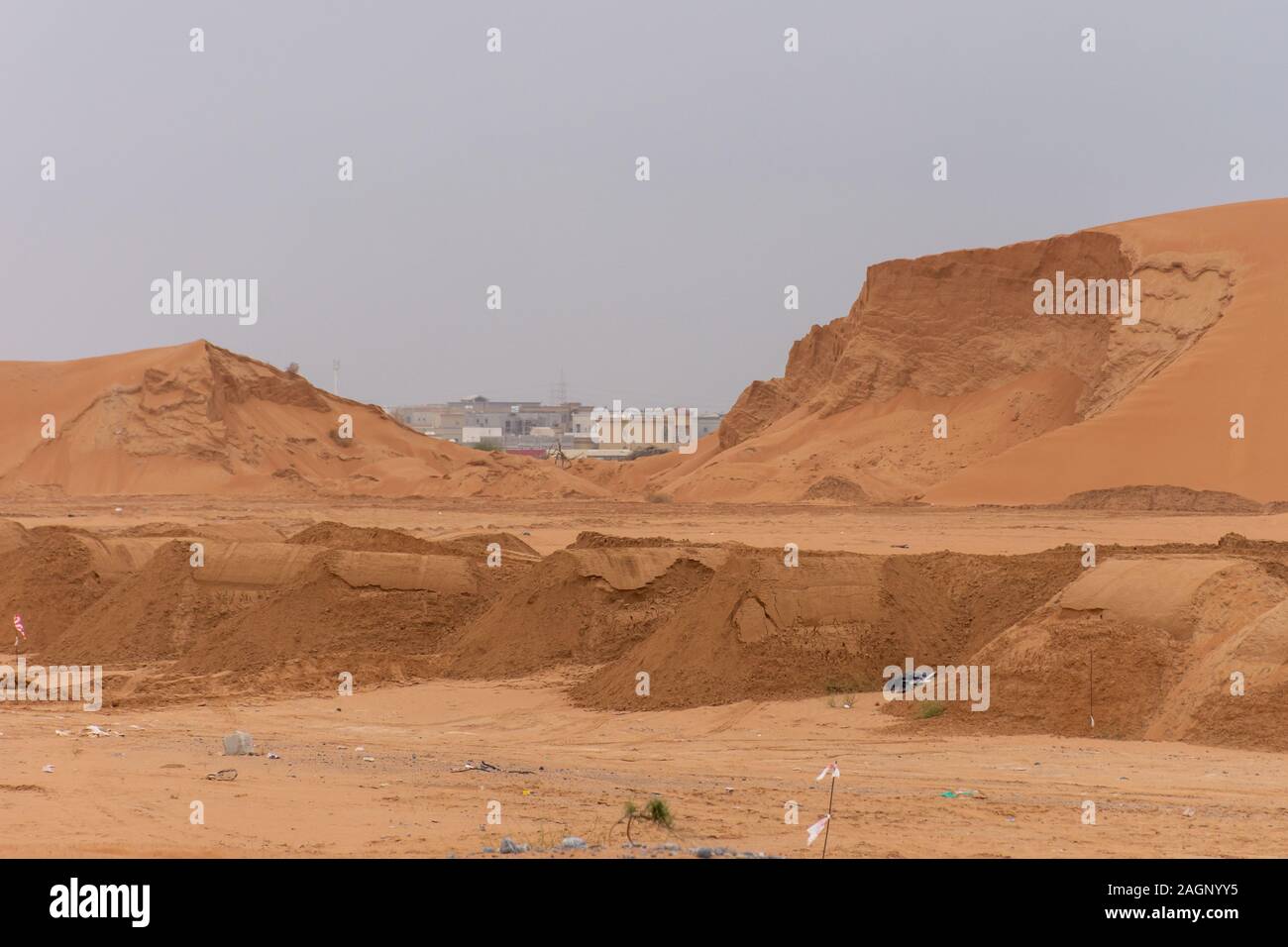 New road construction through the sand excavating and grading the sand ...