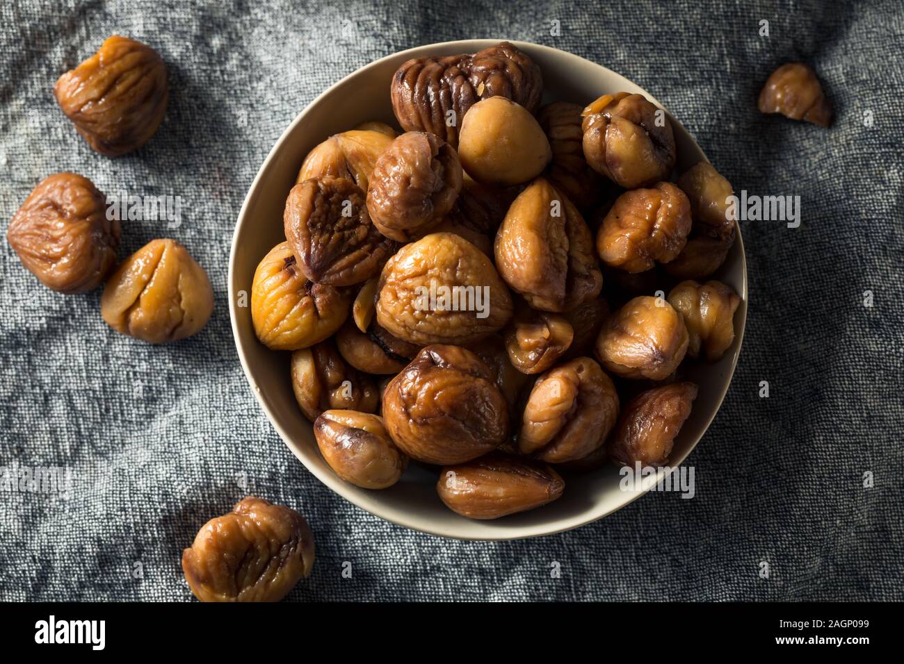 Organic Shelled Roasted Chestnuts in a Bowl Stock Photo - Alamy