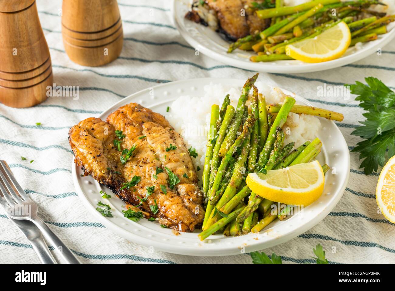 Homemade Sauteed Whitefish Dinner with Asparagus and Rice Stock Photo ...