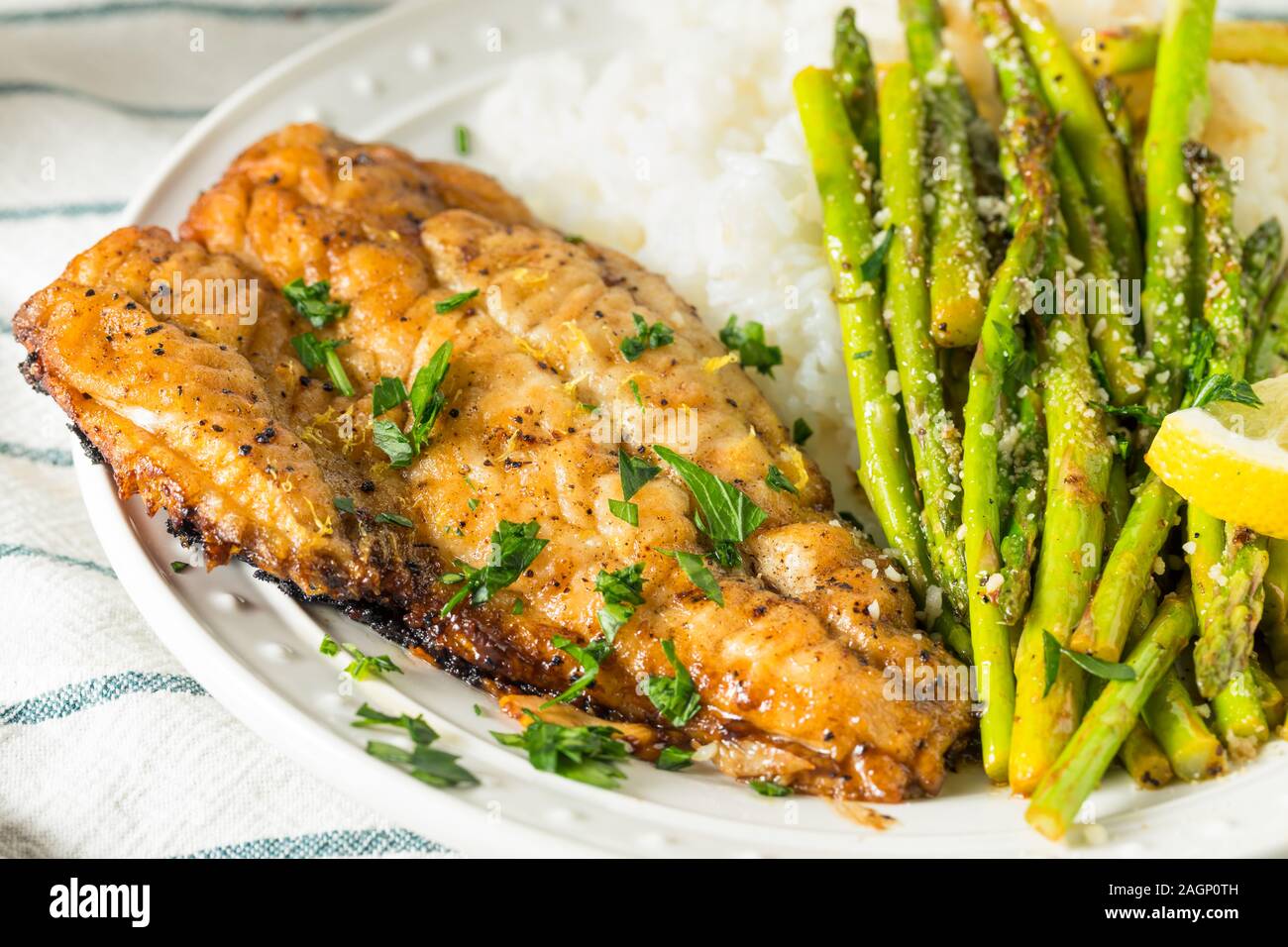 Homemade Sauteed Whitefish Dinner with Asparagus and Rice Stock Photo ...