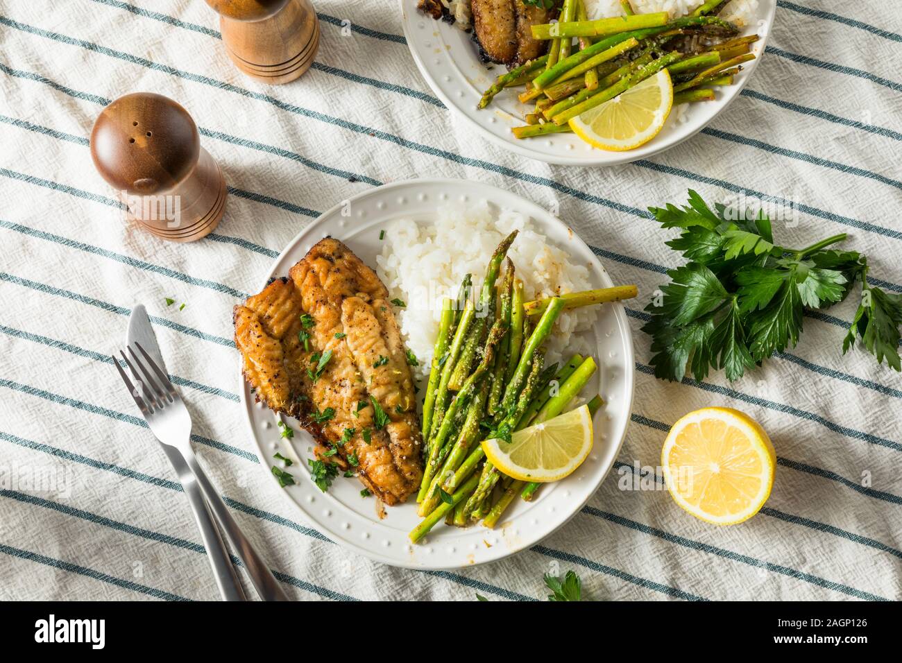Homemade Sauteed Whitefish Dinner with Asparagus and Rice Stock Photo ...