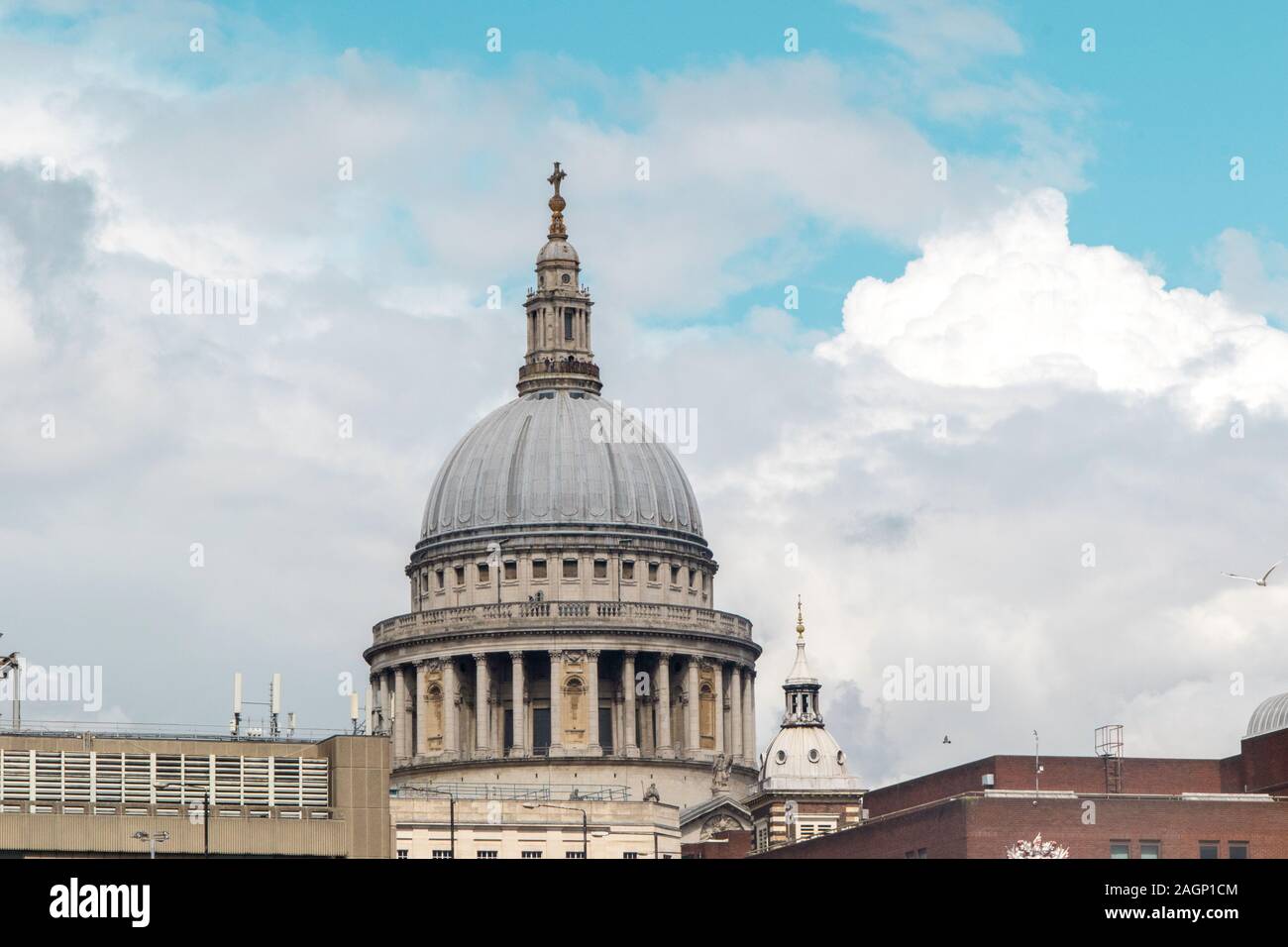 A view of the tip of a large building with a spire on top of it Stock ...
