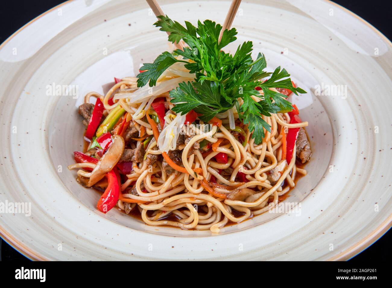 Pad Thai vegetarian vegetables udon noodles in a dark background, top ...