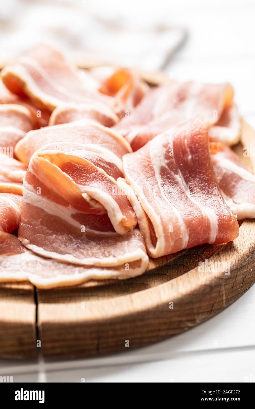 Smoked bacon strips on cutting board Stock Photo - Alamy