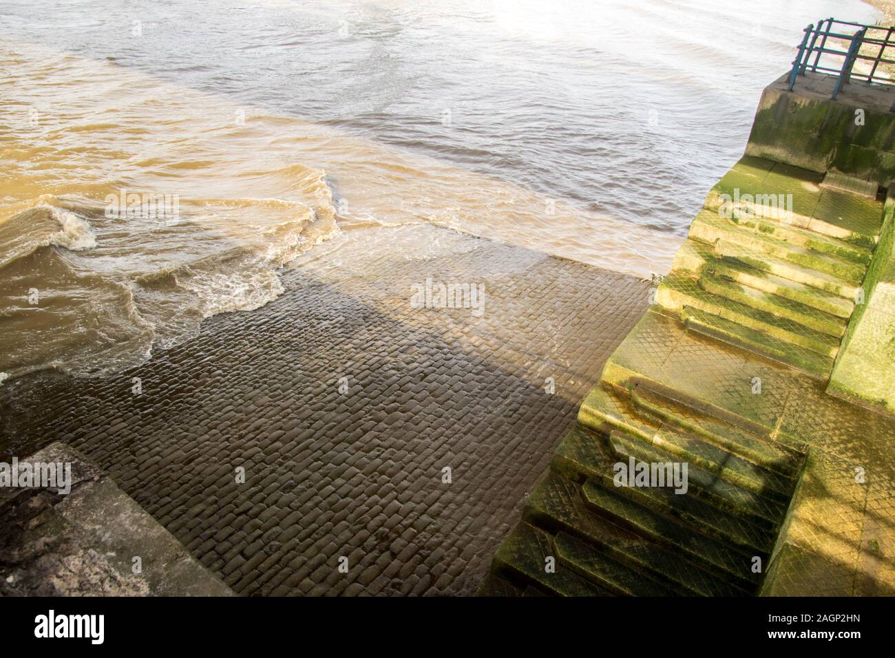 A small section of riverbed is shown at the side of the River Thames ...