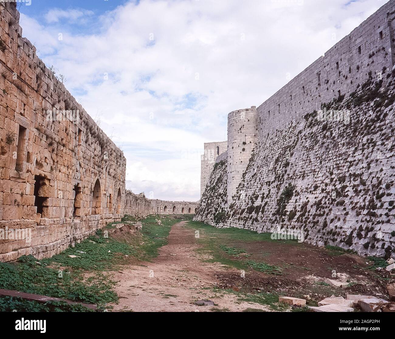 Syria. The inner defensive walls and moat at the ruins of the vast ...