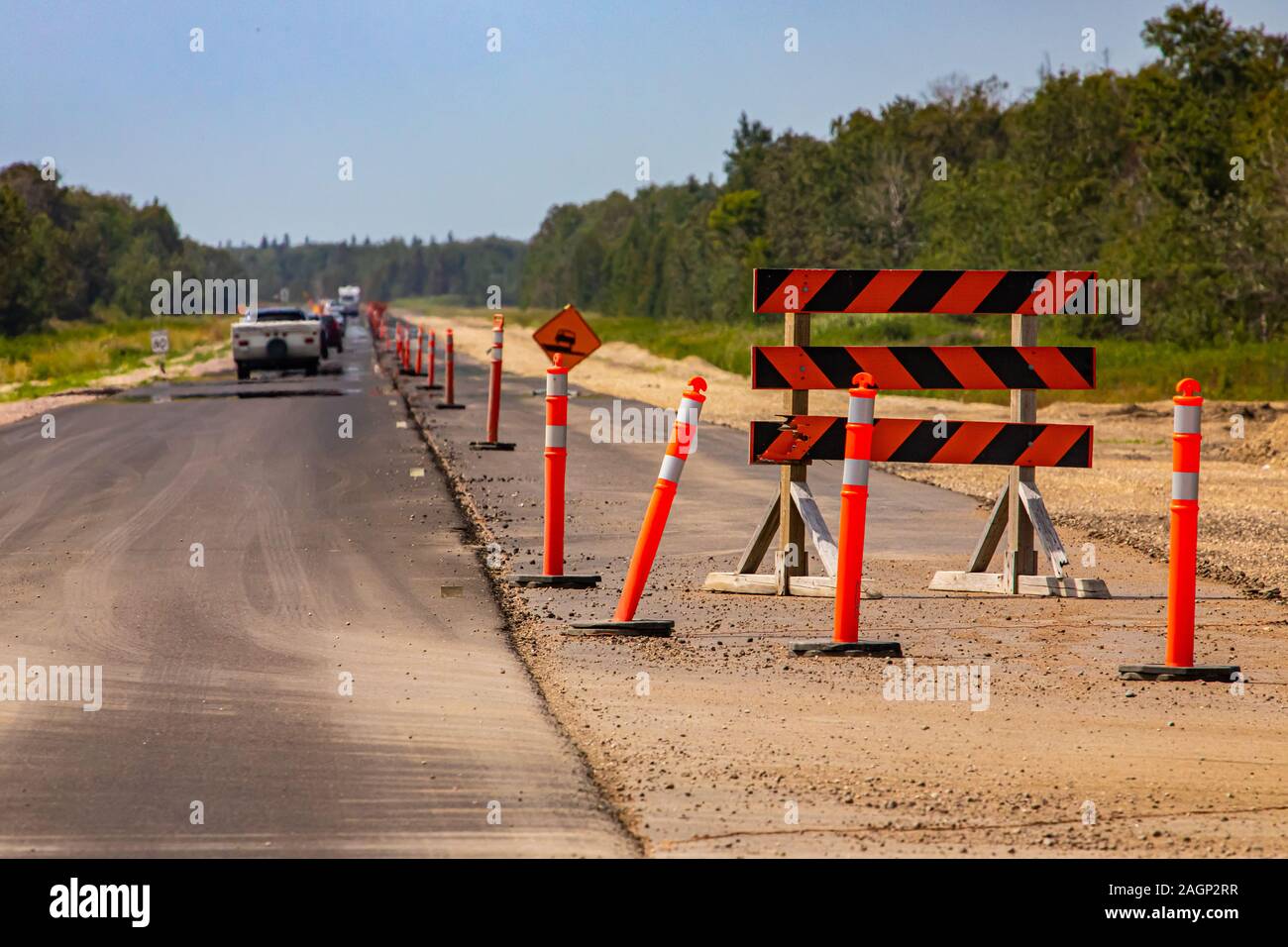 A wide angle view of a new freeway construction through a natural lush ...