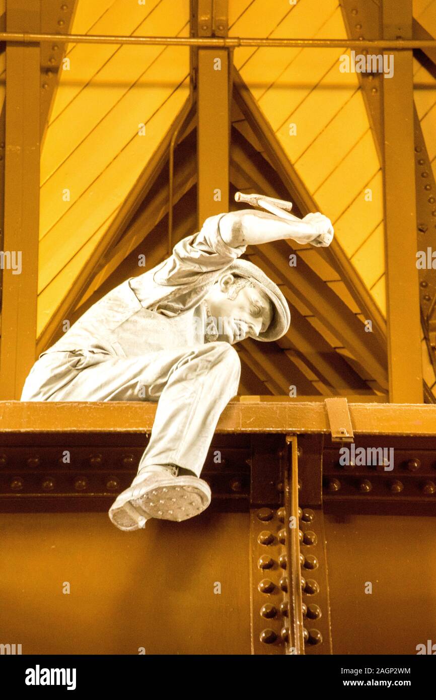 Statue workers above the floors of the Tower Bridge showing how people ...