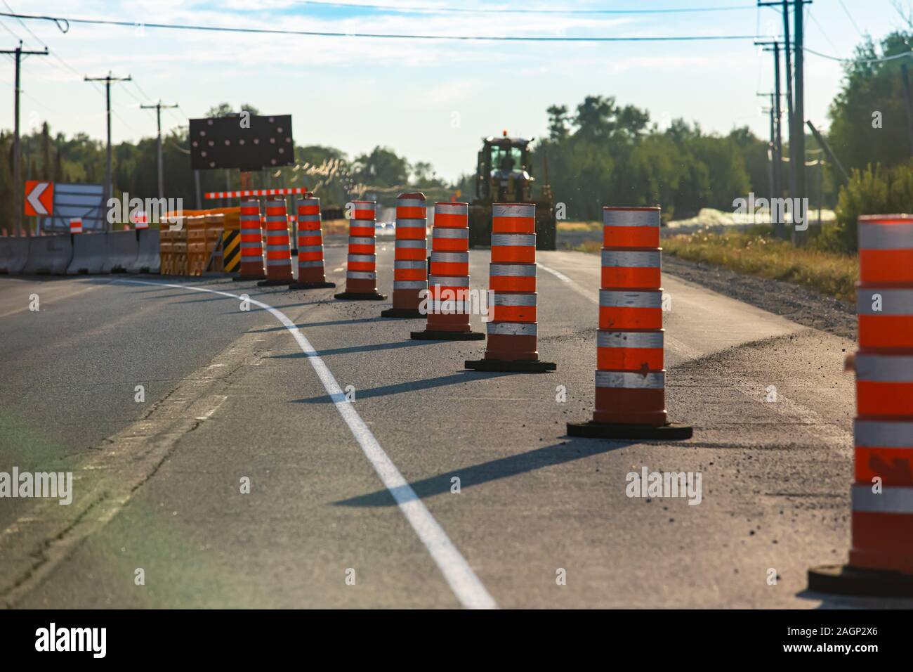 Temporary road cones and lane markings create leading lines as ...