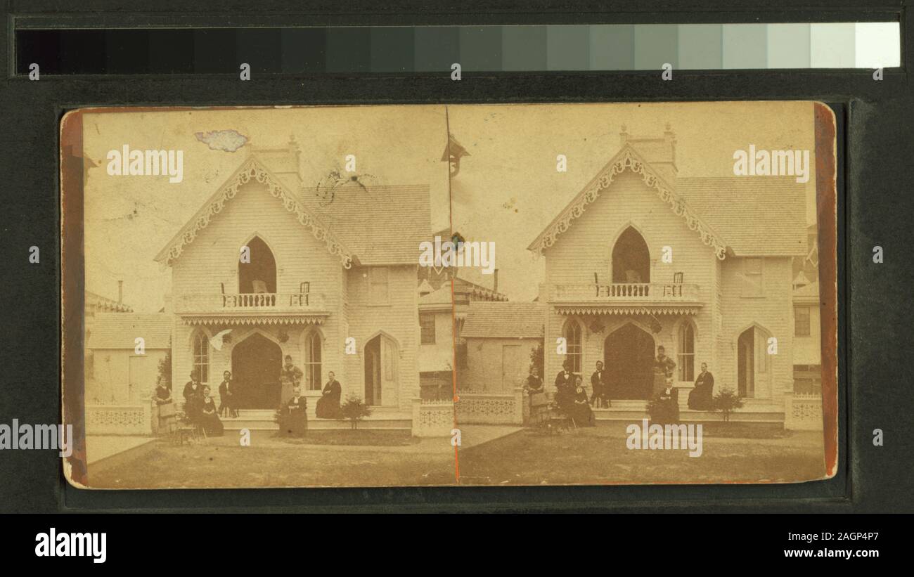 People in front of a cottage People in front of a cottage.; People in ...