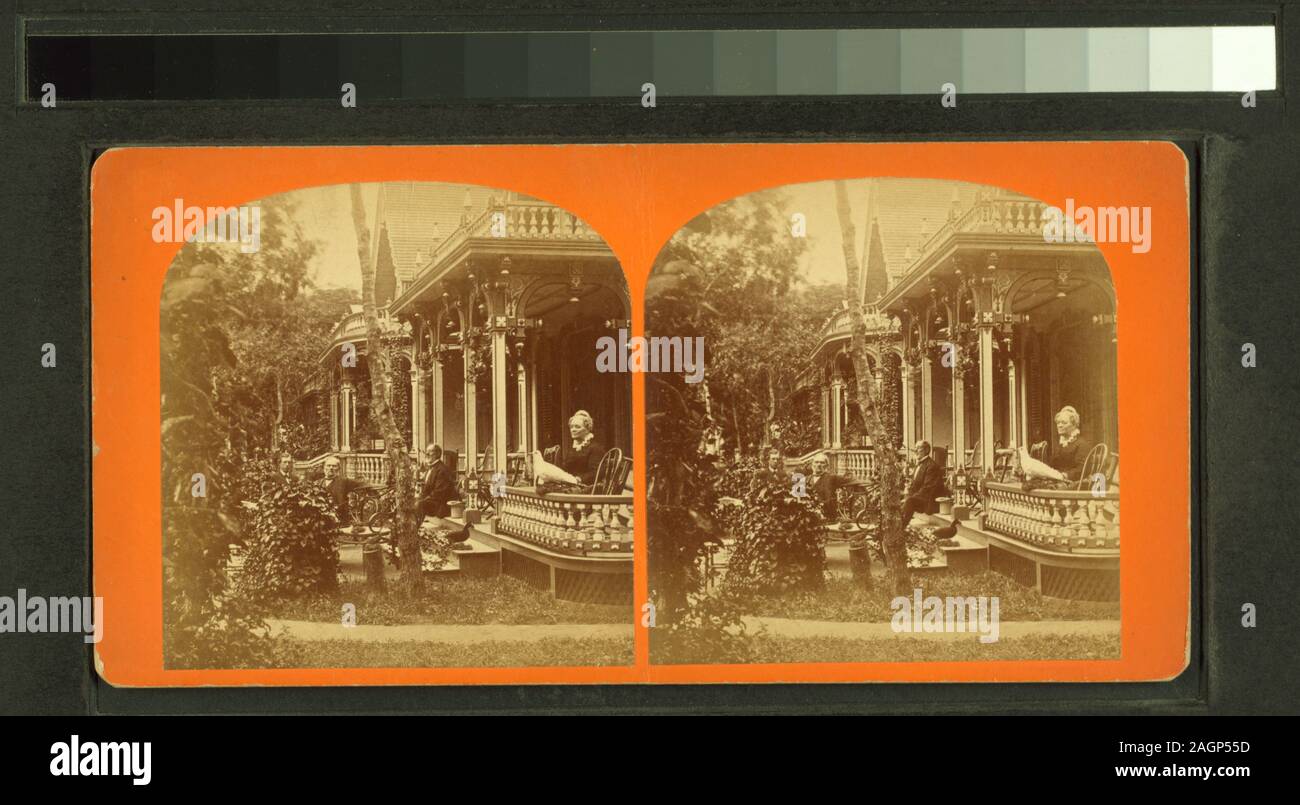 People on the front porch of a cottage People on the front porch of a ...