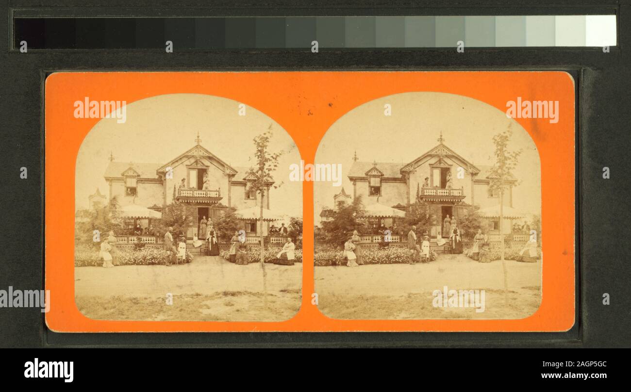 People sitting in the yard, on the porch, and balcony of a cottage ...