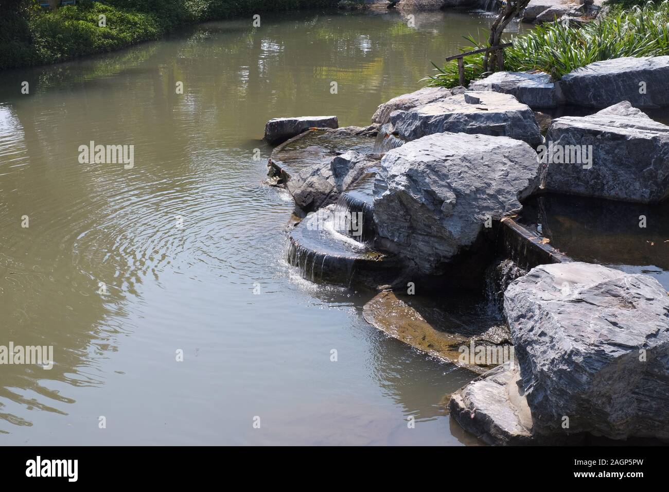 Water flows by rocks hi-res stock photography and images - Alamy