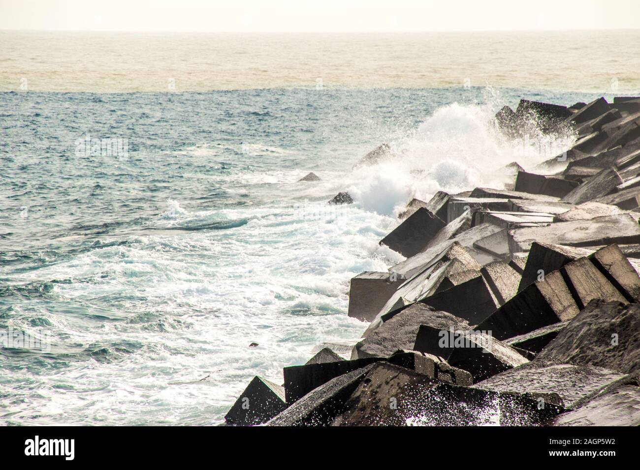 The coast of Catania harbor being battered by large waves during bad ...