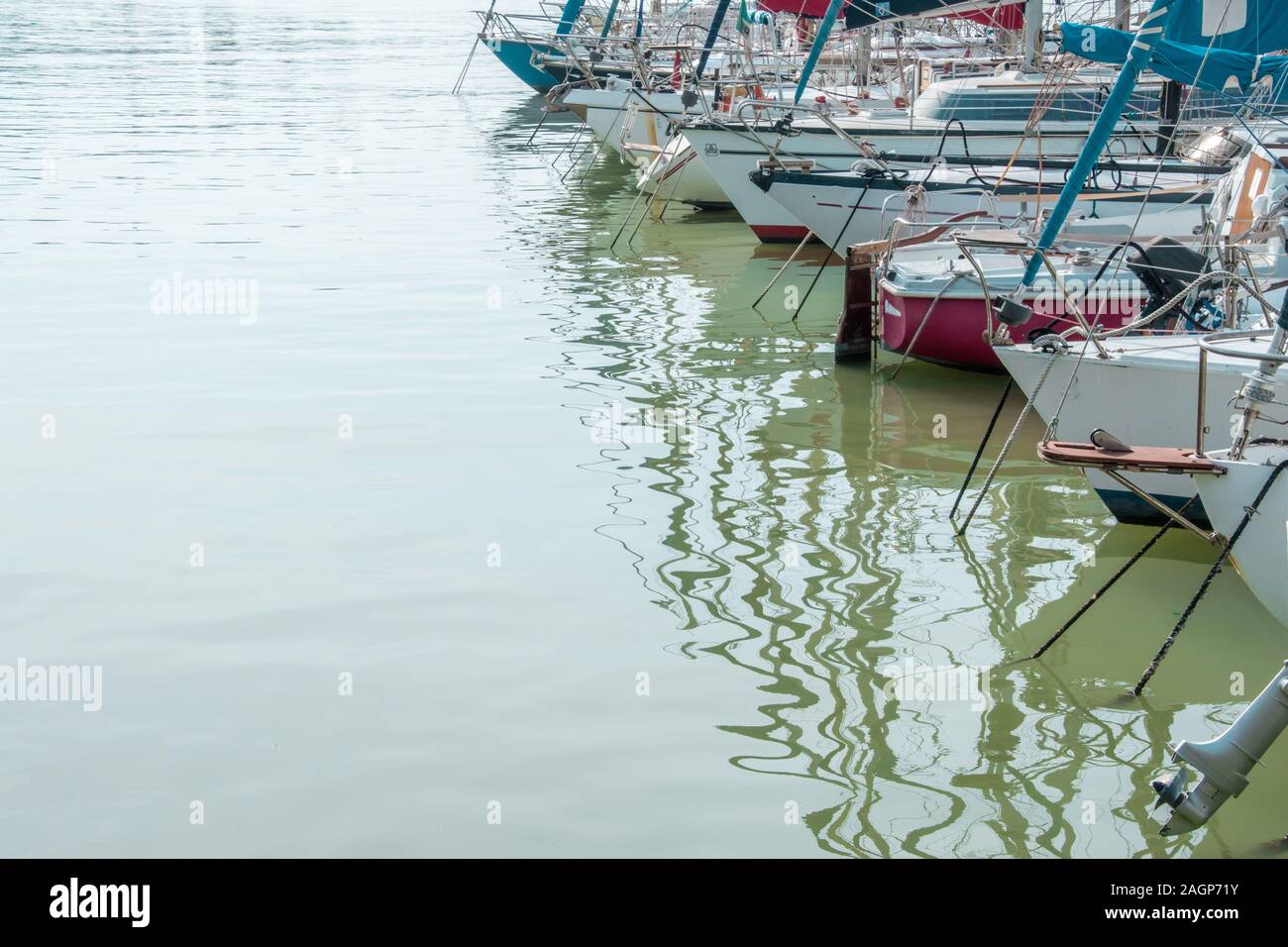 A row of bows of sailing vessels, in harbor Stock Photo - Alamy