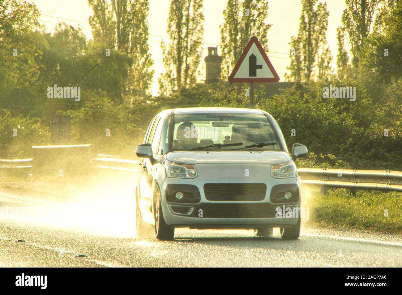 A typical issue with wet roads, road spray, making driving difficult ...