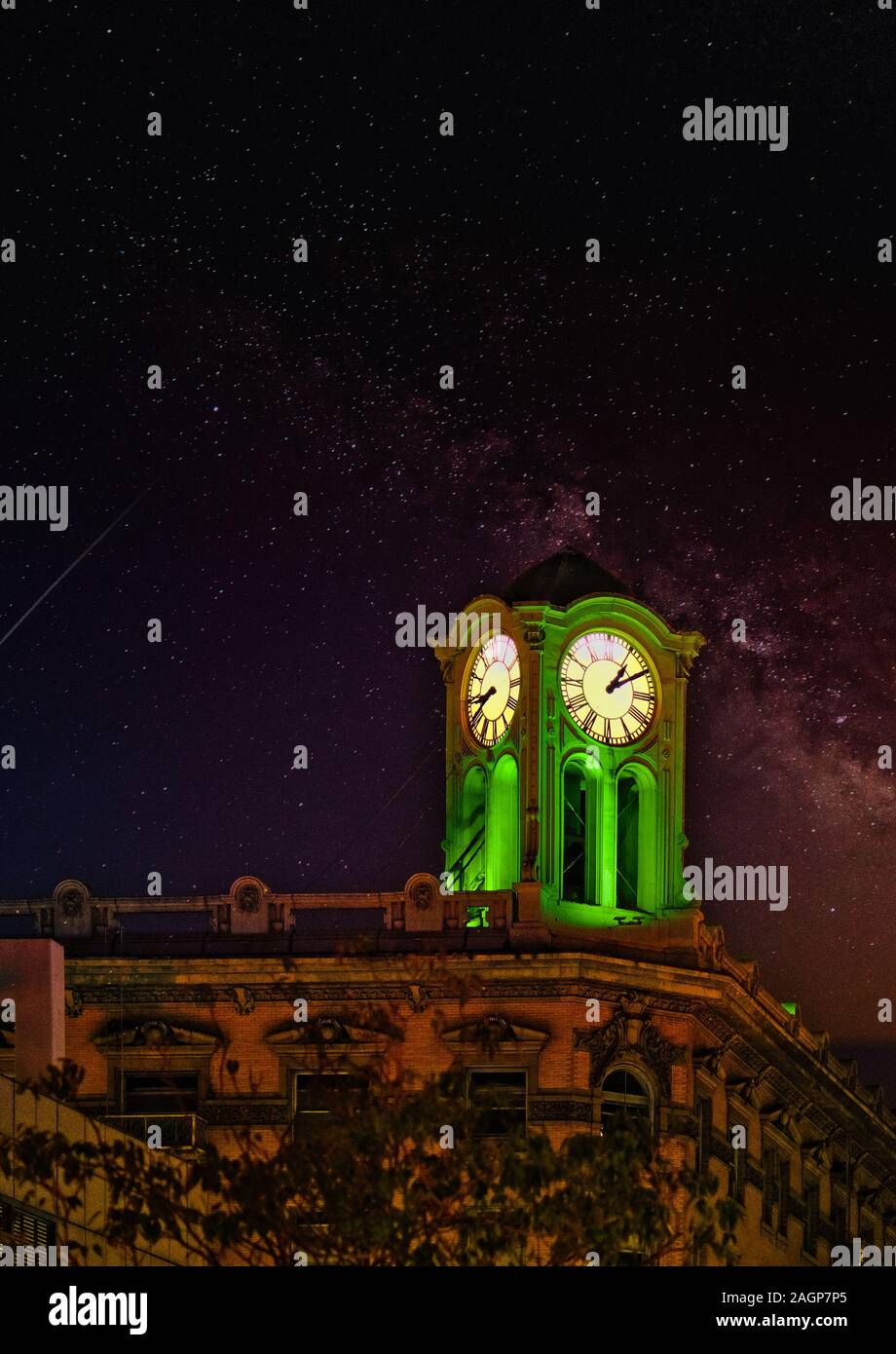 Lighted Clock Tower on Starry Night Stock Photo - Alamy