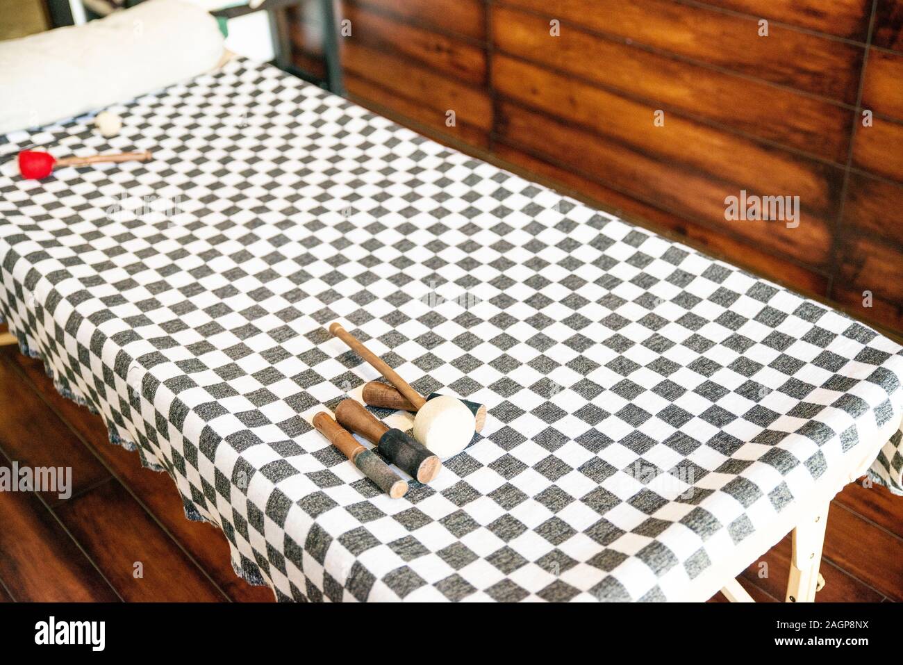 wooden sticks for sound therapy with singing bowls in spa salon Stock ...