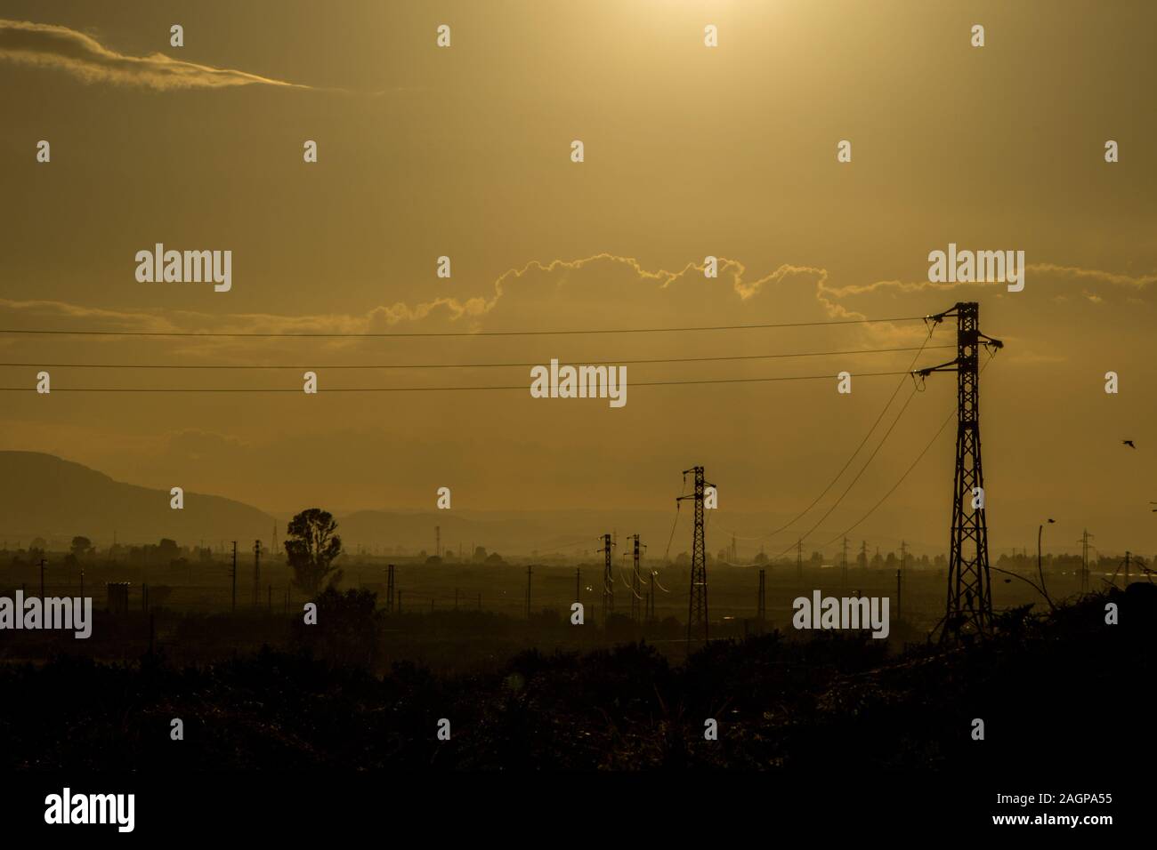 A view from below powerlines supplying electricity to the towns and ...