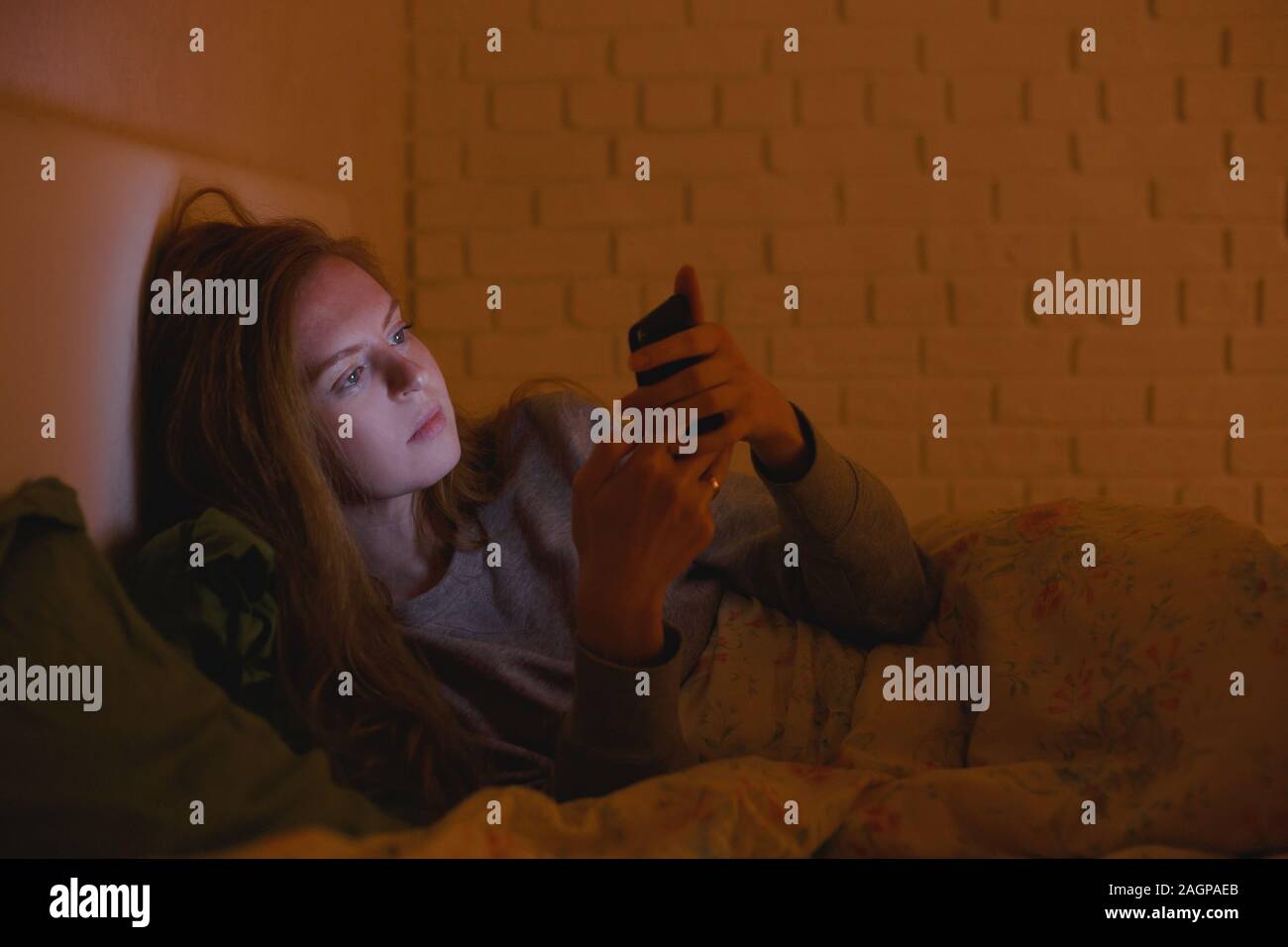 Woman sleeping mobile phone hi-res stock photography and images - Alamy