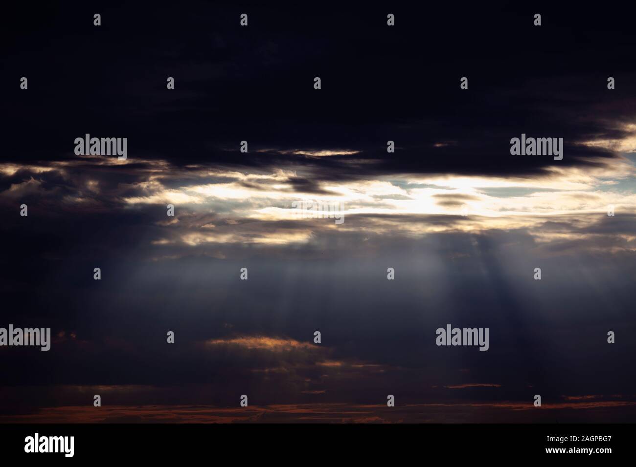 black clouds and sun rays Stock Photo - Alamy