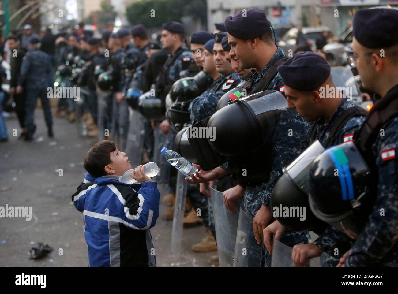 Beirut, Lebanon. 20th Dec, 2019. Policemen stand alert during a protest ...